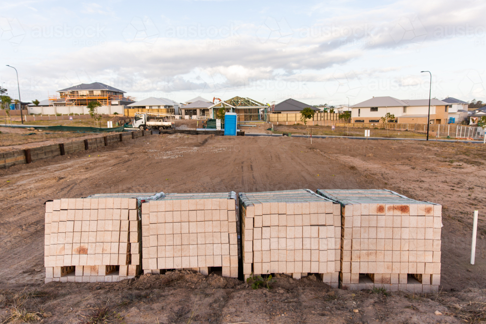 Image of piles of bricks stacked ready for house construction to start ...