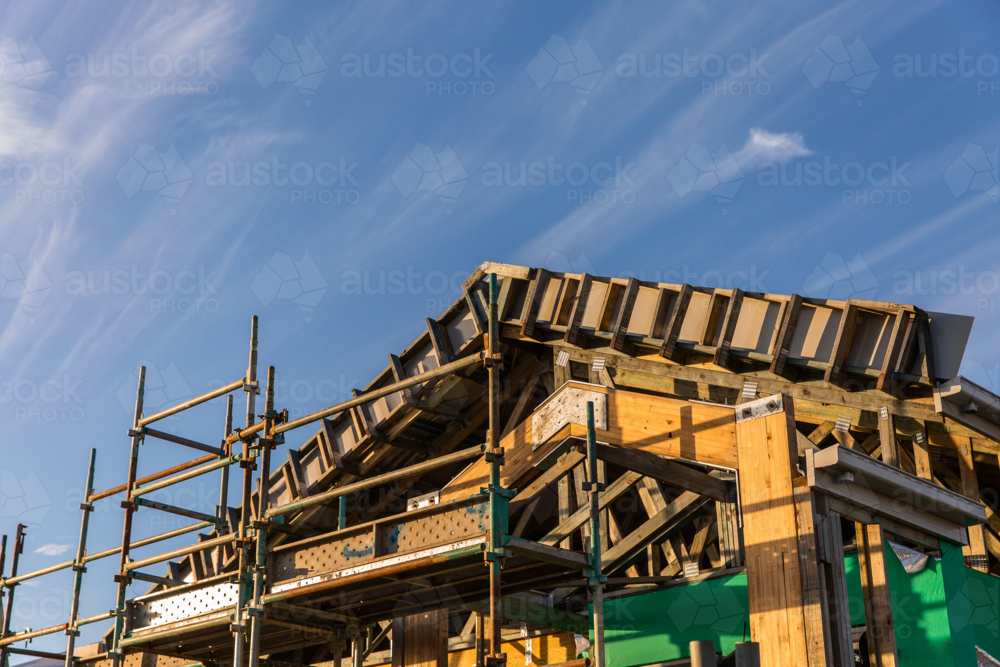 Image of point of a roof of a house getting built on a sunny day ...