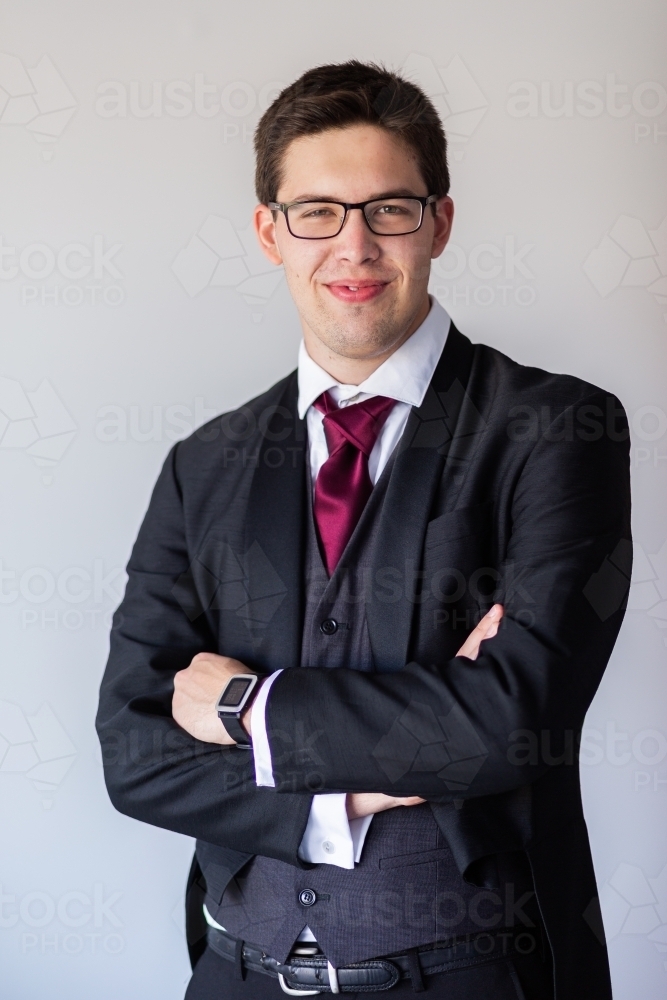 Image of Portrait of a happy young man dressed up in a fancy suit ...