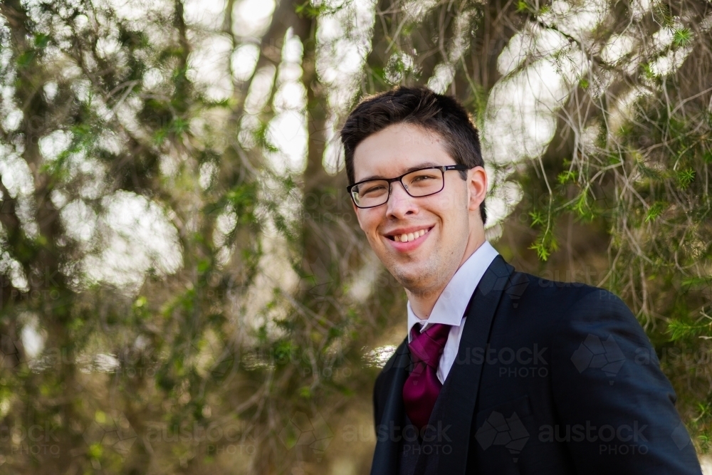 Image of Portrait of a happy young man dressed up in a fancy suit ...