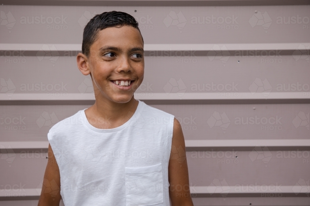 Image of Portrait of a young, smiling first nations boy - Austockphoto