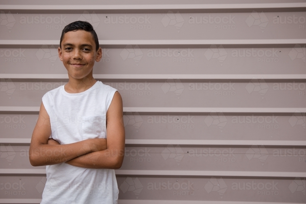 Image of Portrait of a young, smiling first nations boy - Austockphoto