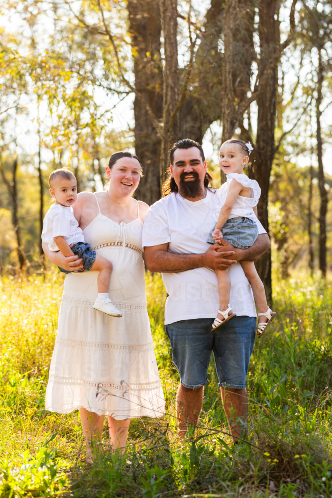 Image of Portrait of Aboriginal dad with two kids and his wife together ...