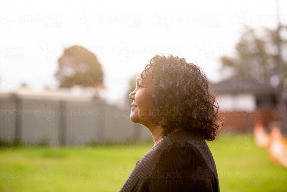 Image of Portrait of Aboriginal woman alone in the afternoon - Austockphoto