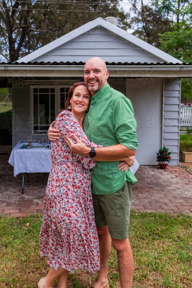 Image Of Portrait Of Aussie Couple In Their Forties In Front Of Country Garage Austockphoto