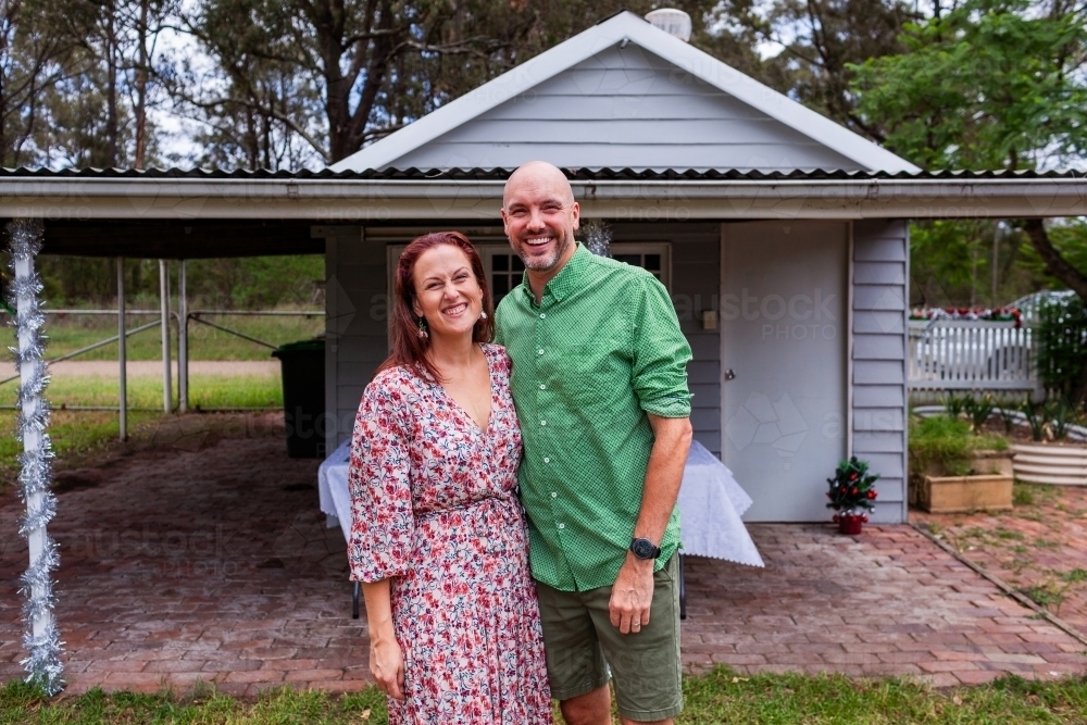 Image of Portrait of Aussie couple in their forties in front of country ...