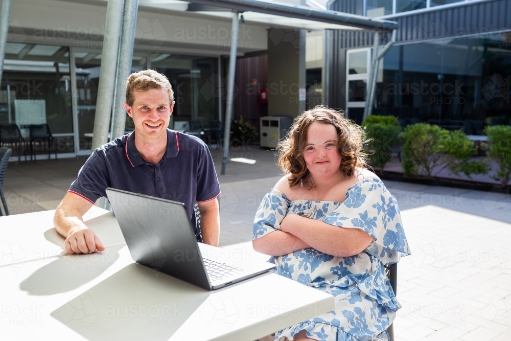 Image of Portrait of female teenager with down syndrome at cafe table ...