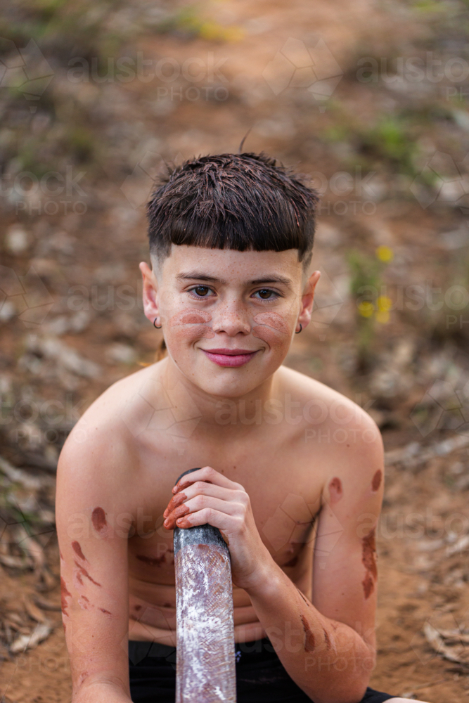 Image of Portrait of First Nations Australian kid holding didgeridoo ...
