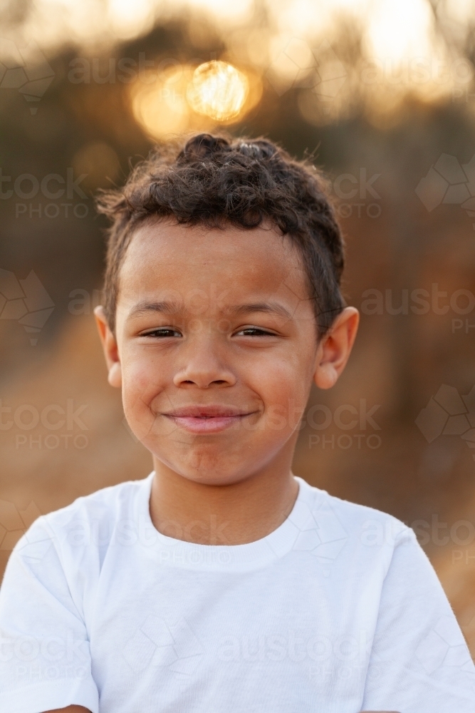 Image of Portrait of first nations Australian kid outside at sunset ...
