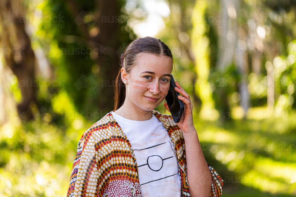 Image of Portrait of First nations Australian teen girl using mobile ...
