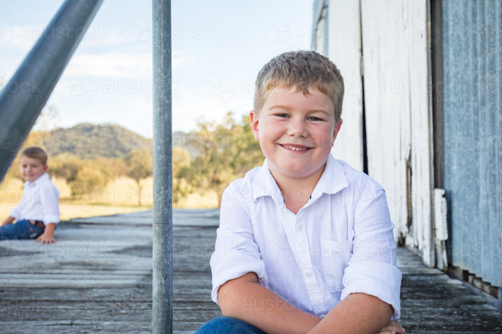 Image of Portrait of happy little boy smiling on farm - Austockphoto