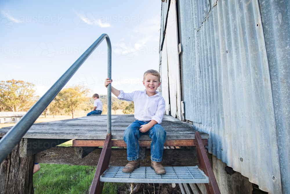 Image of Portrait of happy little boy smiling on farm - Austockphoto