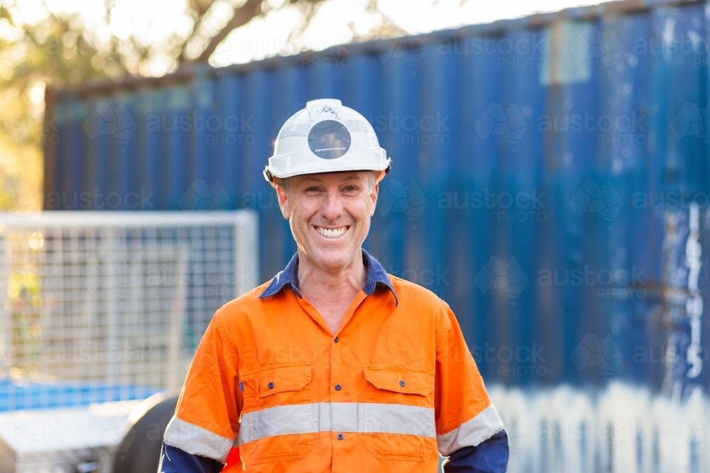 Image of Portrait of happy smiling handyman tradie with protective ...