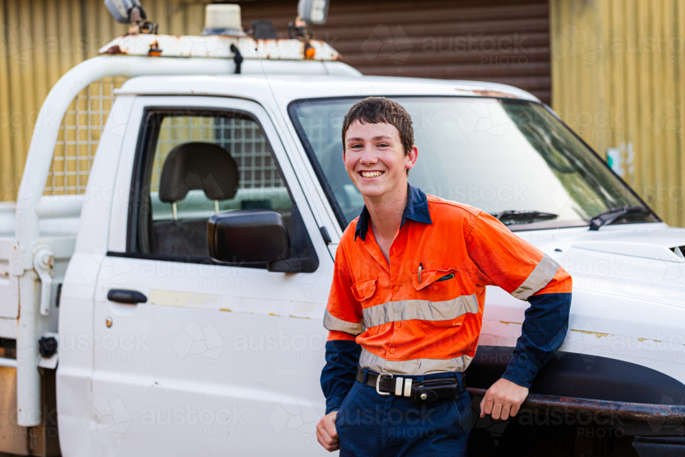 Image of Portrait of happy smiling young male trade apprentice in high ...