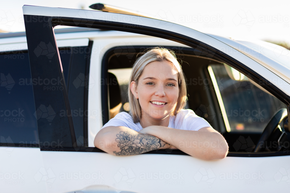 Image of portrait of happy young First Nations Australian woman leaning ...