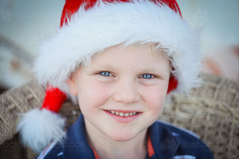 Image of Portrait of little boy wearing Santa hat at Christmas time ...