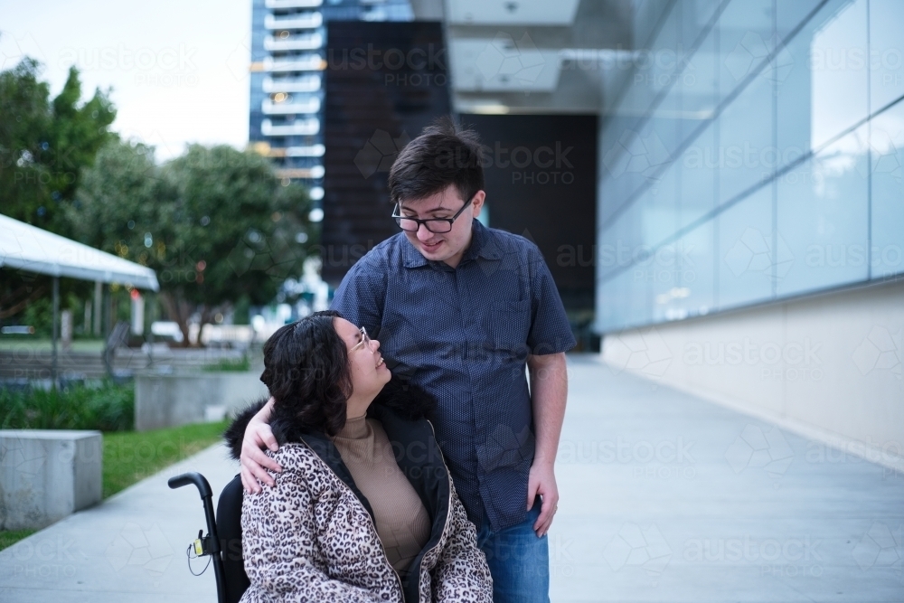 Image of Portrait of man standing and hugging a woman with a disability ...