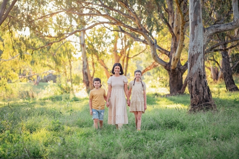 Image of Portrait of mother and children walking together in Australian ...