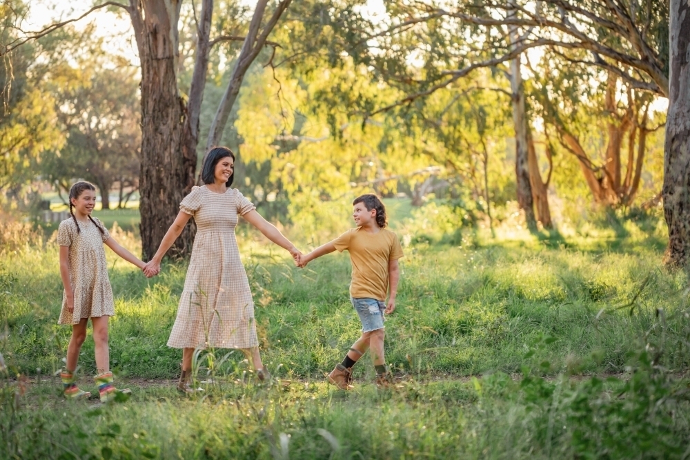 Image of Portrait of mother and children walking together in Australian ...