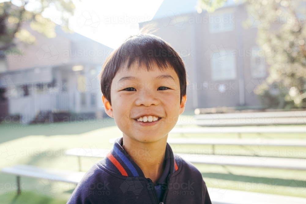 Image of Portrait of primary school boy in the playground at school ...