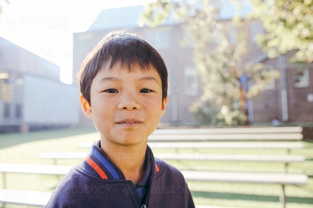 Image of Portrait of primary school boy in the playground at school ...