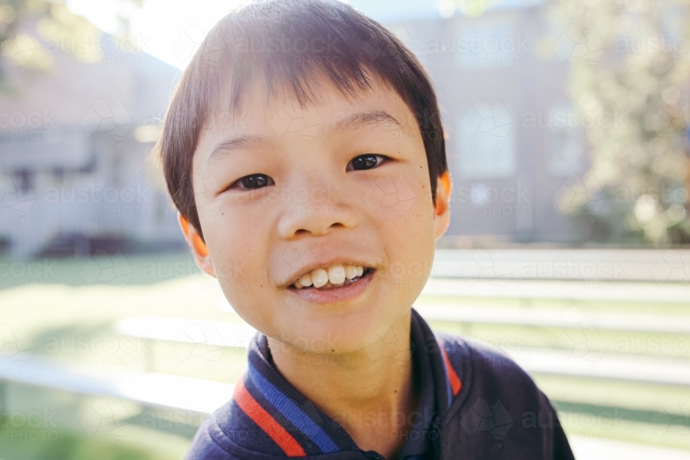 Image of Portrait of primary school boy in the playground at school ...