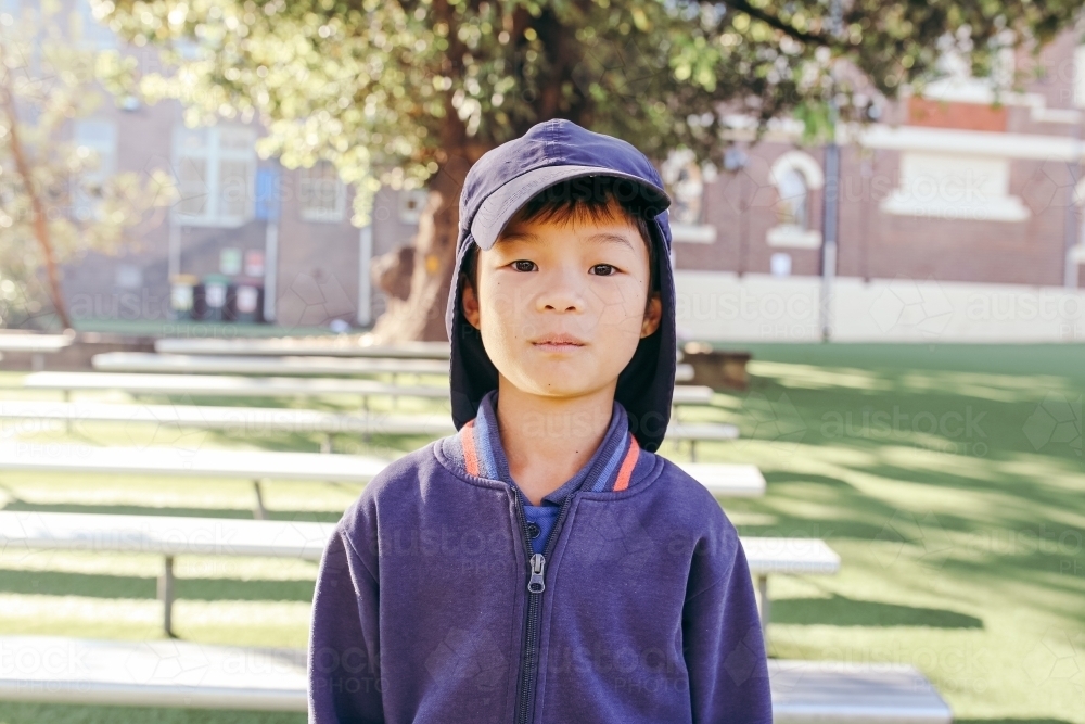 Image of Portrait of primary school boy in the playground at school ...