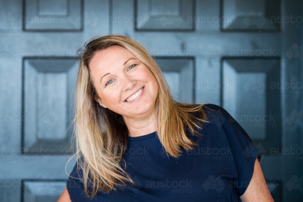 Image of portrait of smiling 40something woman - Austockphoto