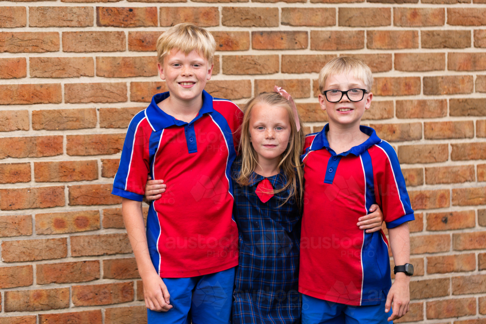 Image of Portrait of three Australian school kid siblings in uniform ...