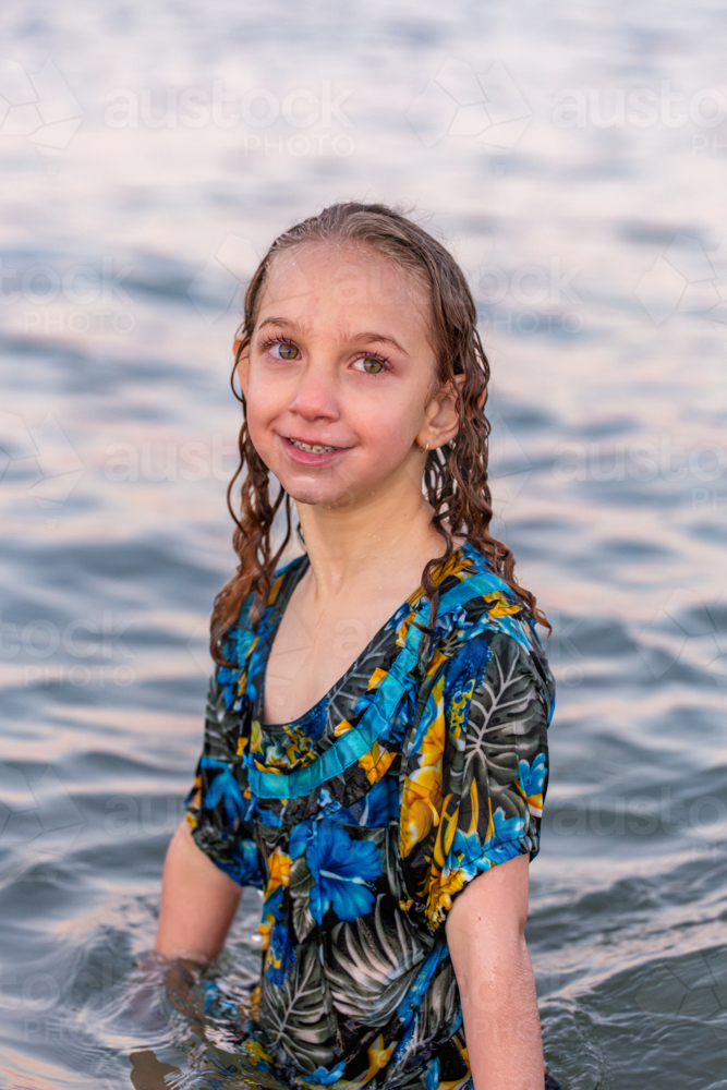 Image of Portrait of Torres Strait Islander child swimming in the ocean ...