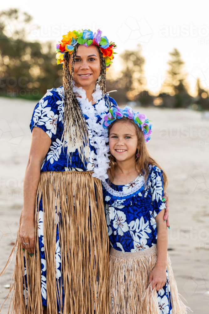 Image of Portrait of Torres Strait Islander girl and mother in traditional dancer floral dress ...