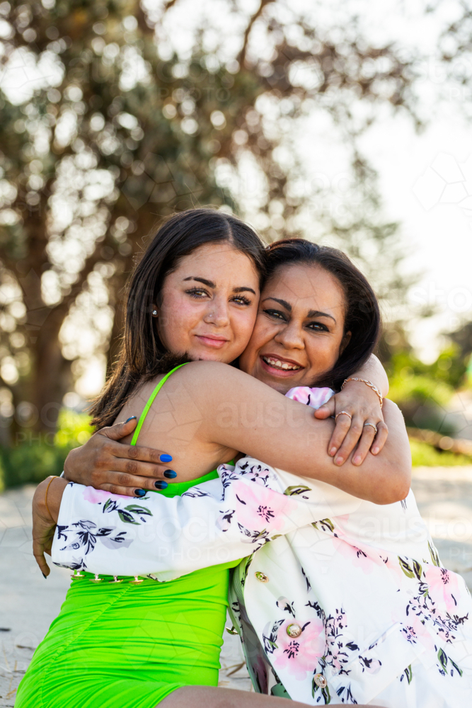 Image of Portrait of Torres Strait Islander mother in her thirties and young daughter together ...