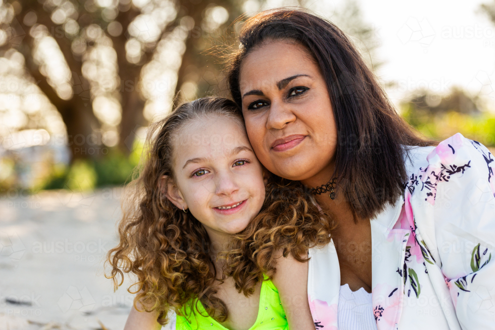 Image of Portrait of Torres Strait Islander mother in her thirties and young daughter together ...
