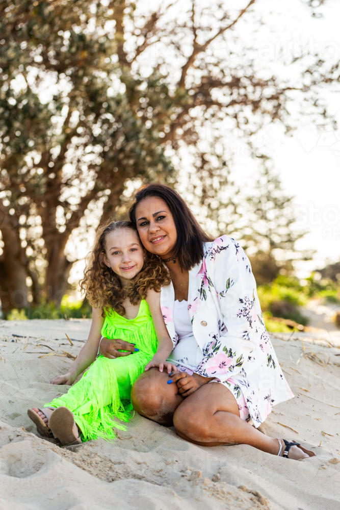 Image of Portrait of Torres Strait Islander mother in her thirties and young daughter together ...