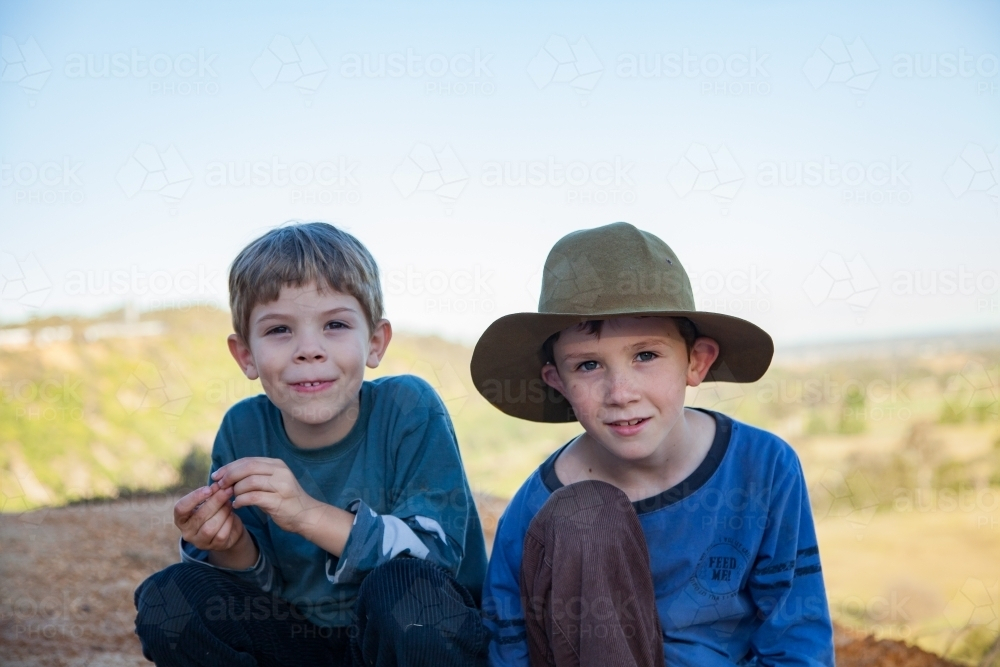 Image of Portrait of two happy Aussie kids with copy space in rural ...