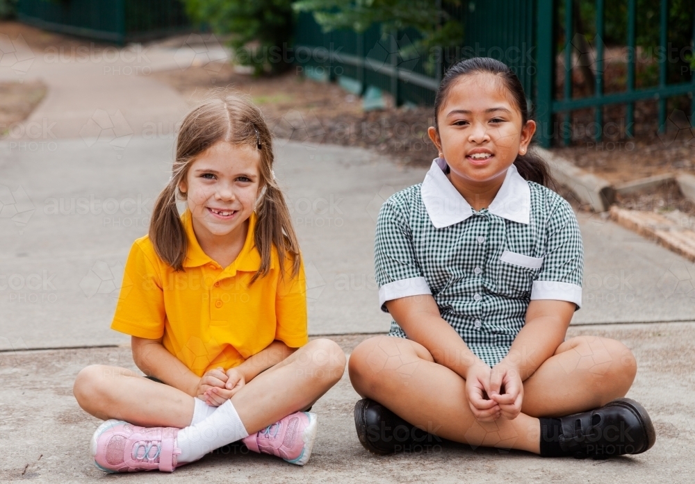 Image of Portrait of two happy Aussie school kids - Austockphoto
