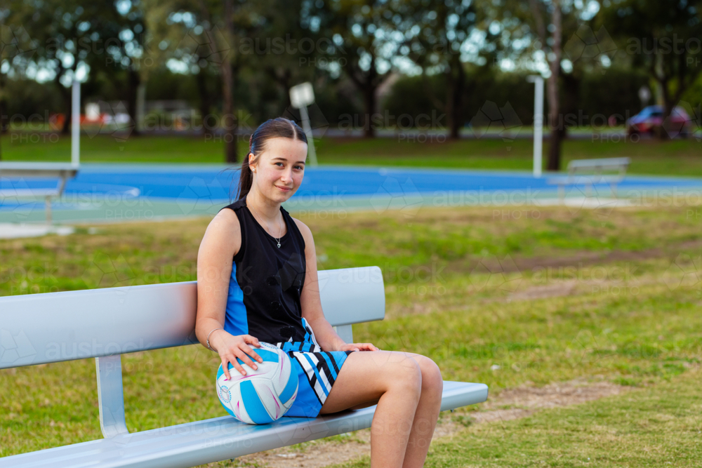 Image of Portrait of young Aboriginal sports player girl sitting on ...