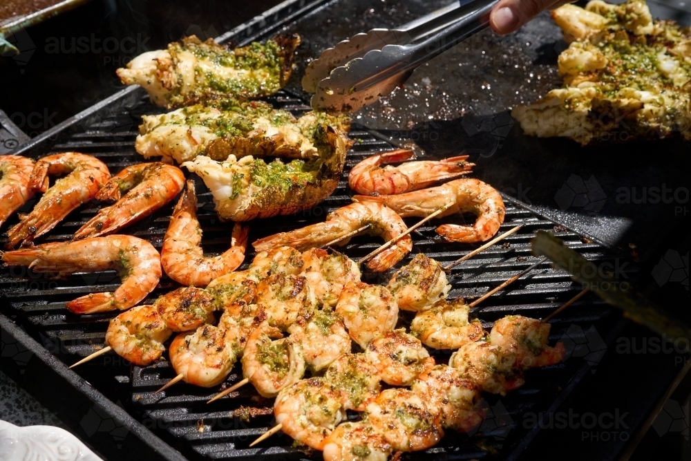 Image of Prawns and Moreton Bay Bugs cooking on barbecue - Austockphoto