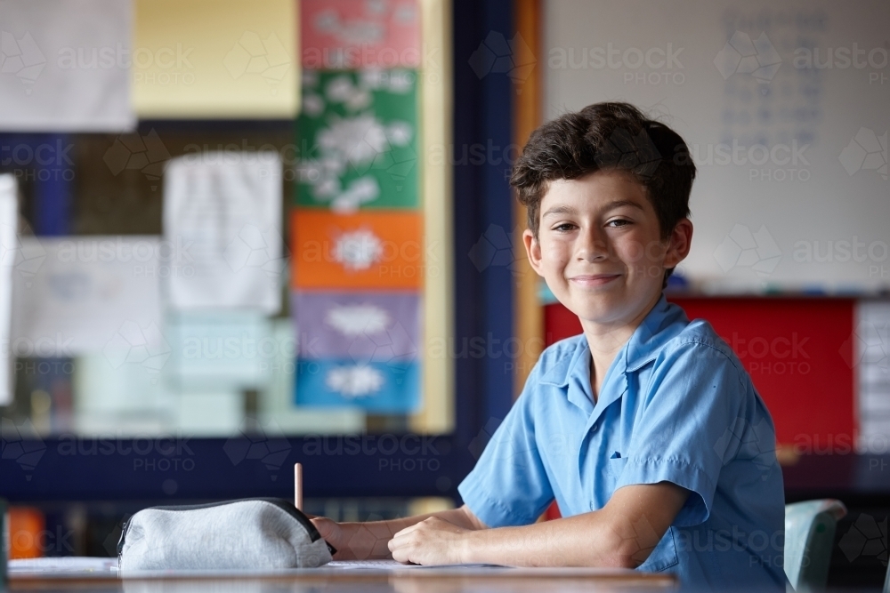 Image of Primary school student in classroom - Austockphoto