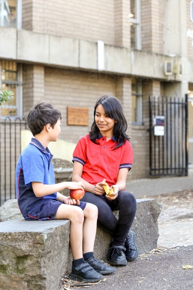 Image of primary school students holding healthy food for fruit break ...