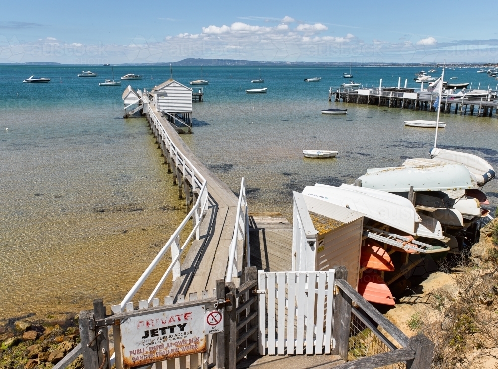 Image of Private jetty and rowboats - Austockphoto