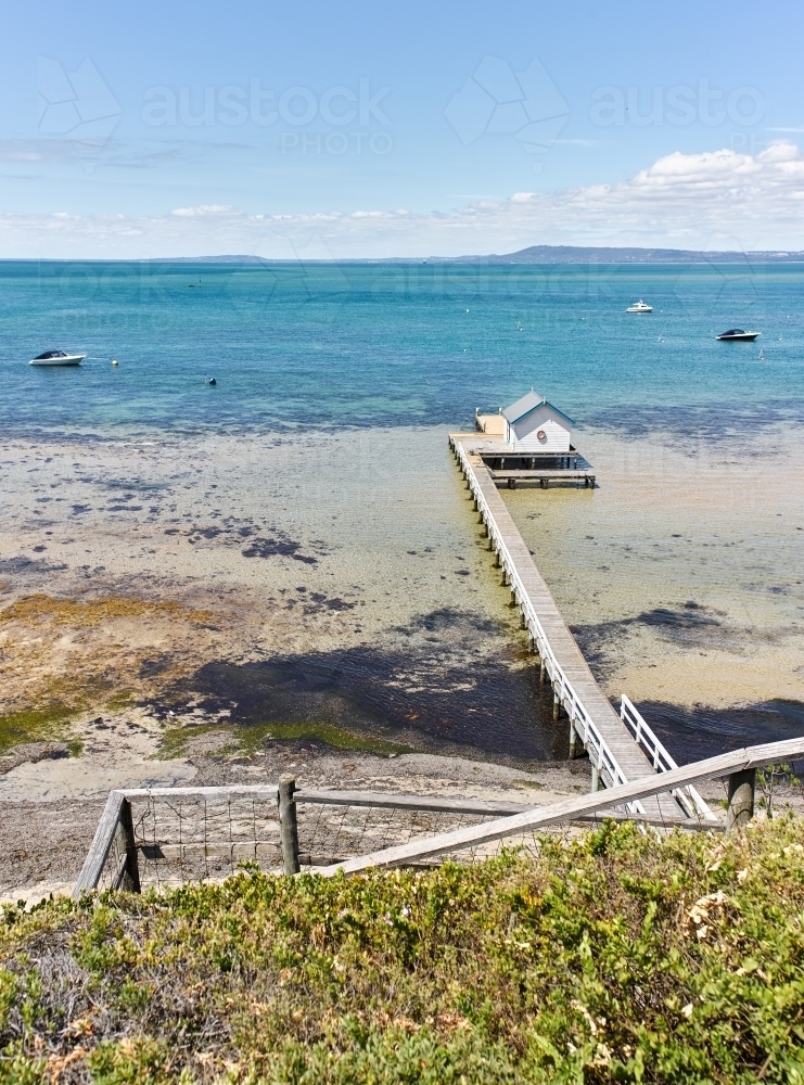 Image of Private Jetty & boat shed from cliffside walkway - Austockphoto