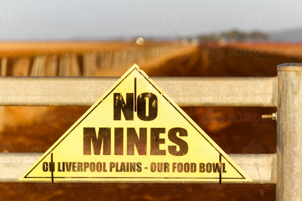 Image of Protest sign on farm gate - No Mines. - Austockphoto