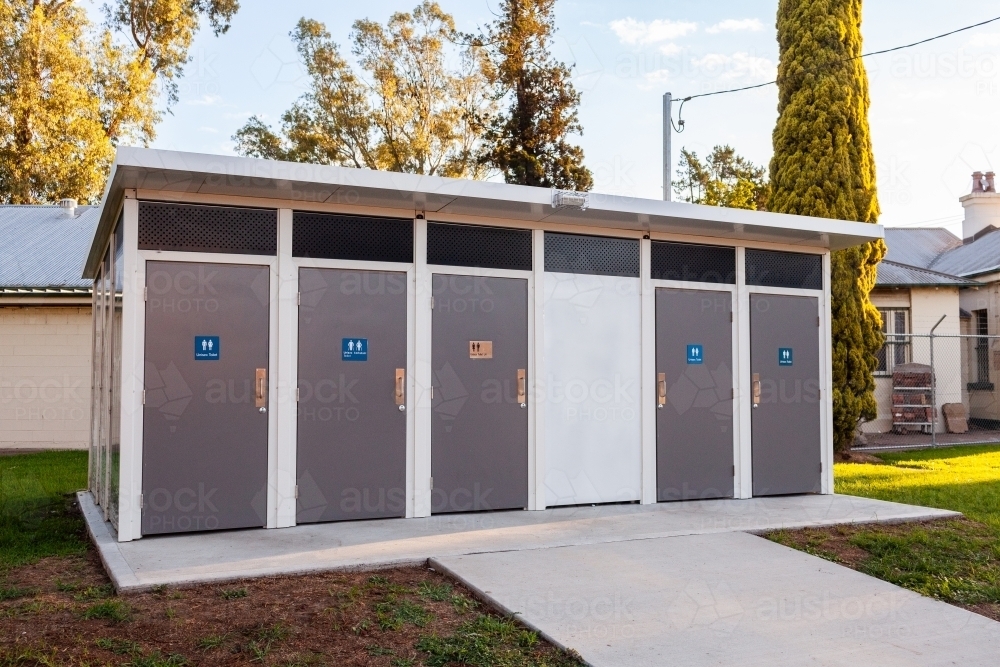Image of Public toilet block in park in evening - Austockphoto