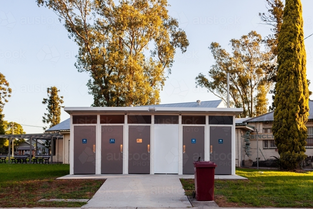 Image of Public toilet block in park in evening - Austockphoto