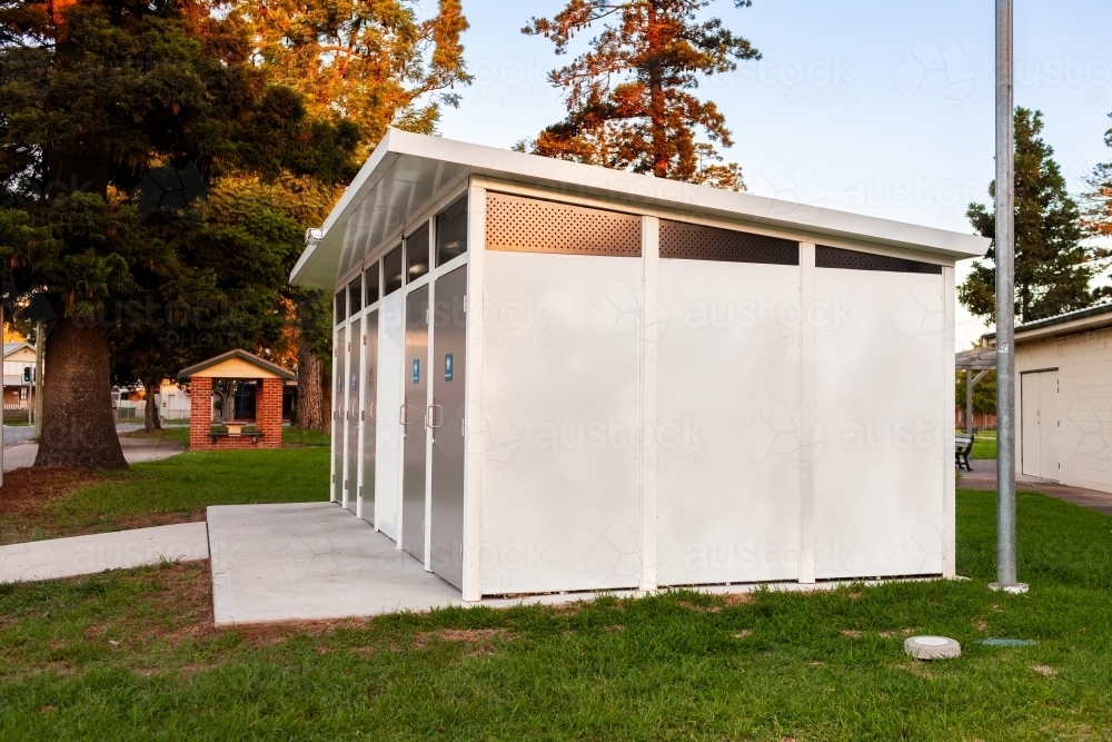 Image of Public toilet block in park in evening - Austockphoto