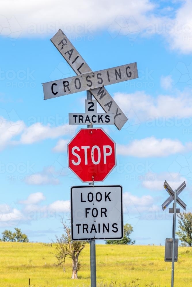 Image of Railway train crossing stop sign - Austockphoto