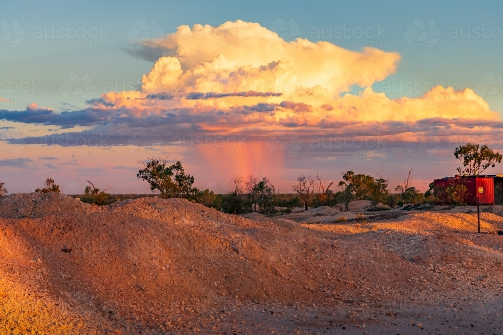 Image of Rain falling from a large thunderstorm over an outback mining ...