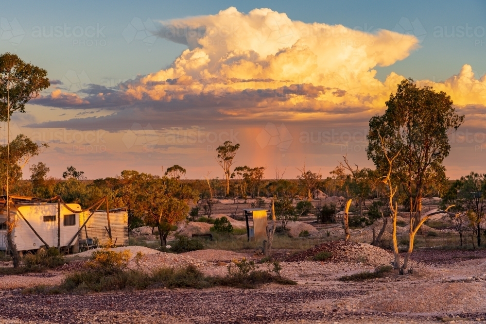 Image of Rain falling from a large thunderstorm over an outback mining ...