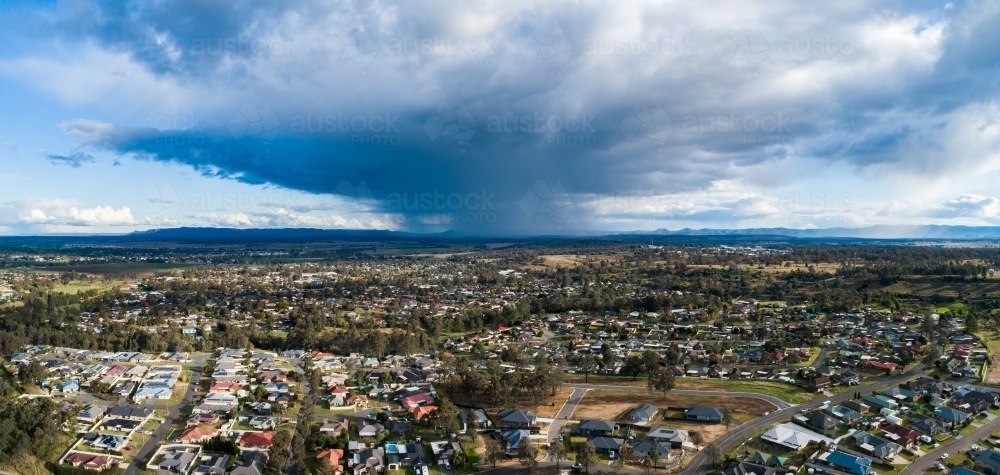 Image of rain falling from distant clouds in sky looking over ...